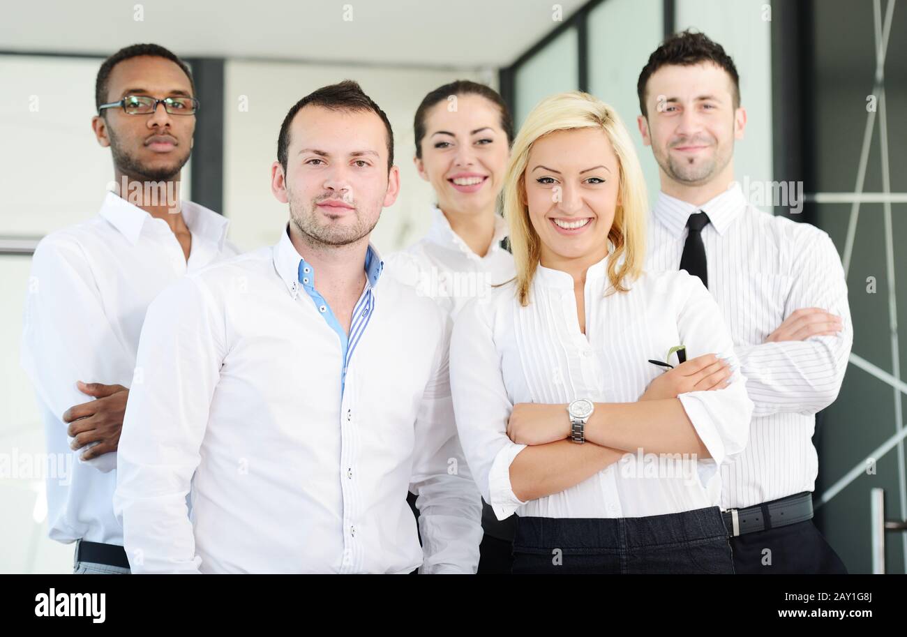 Business portrait - Happy multi ethnic executives standing together ...