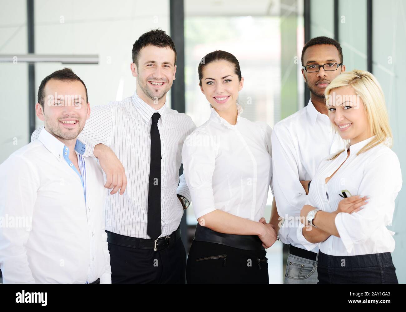 Business portrait - Happy multi ethnic executives standing together ...