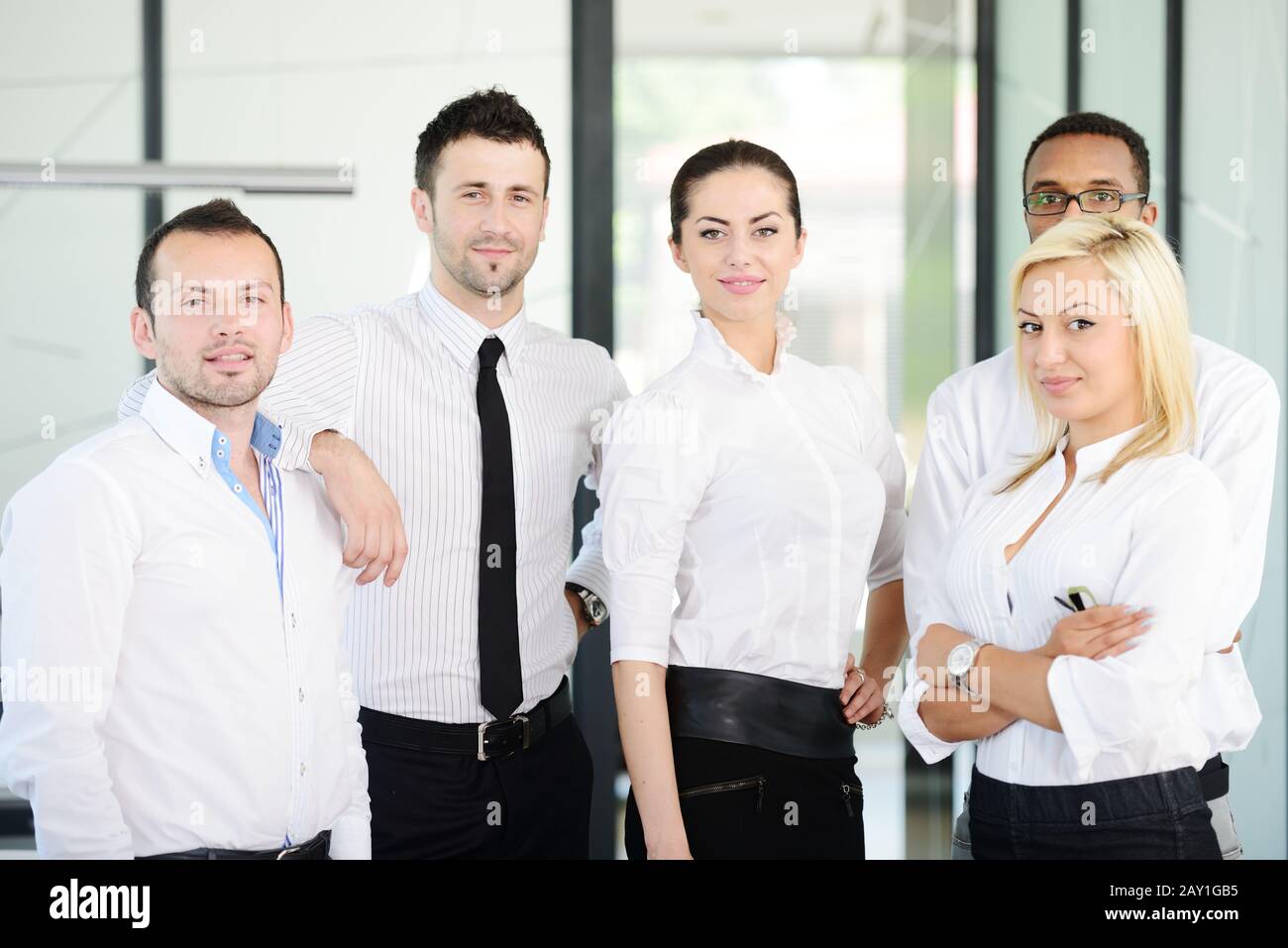 Business portrait - Happy multi ethnic executives standing together ...