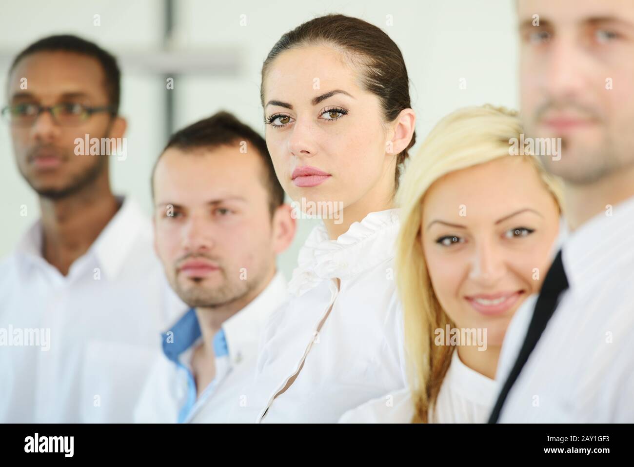 Successful business people in line Stock Photo - Alamy
