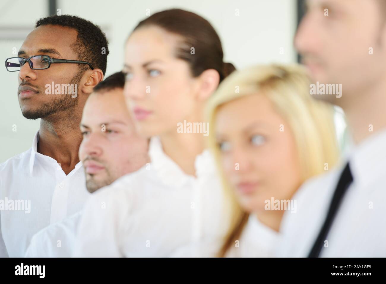 Successful business people in line Stock Photo - Alamy