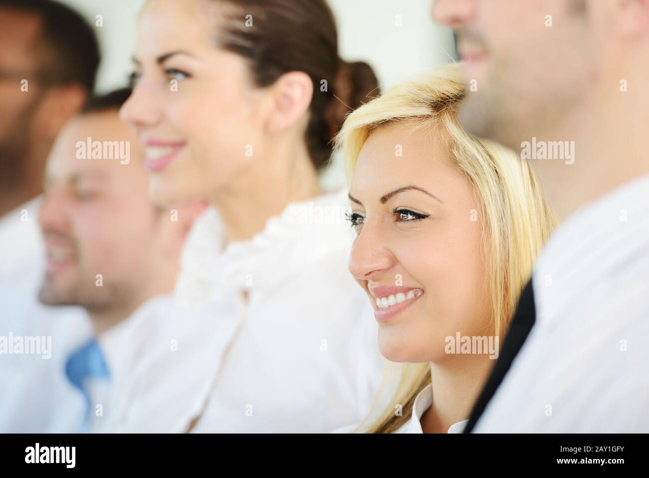 Successful business people in line Stock Photo - Alamy