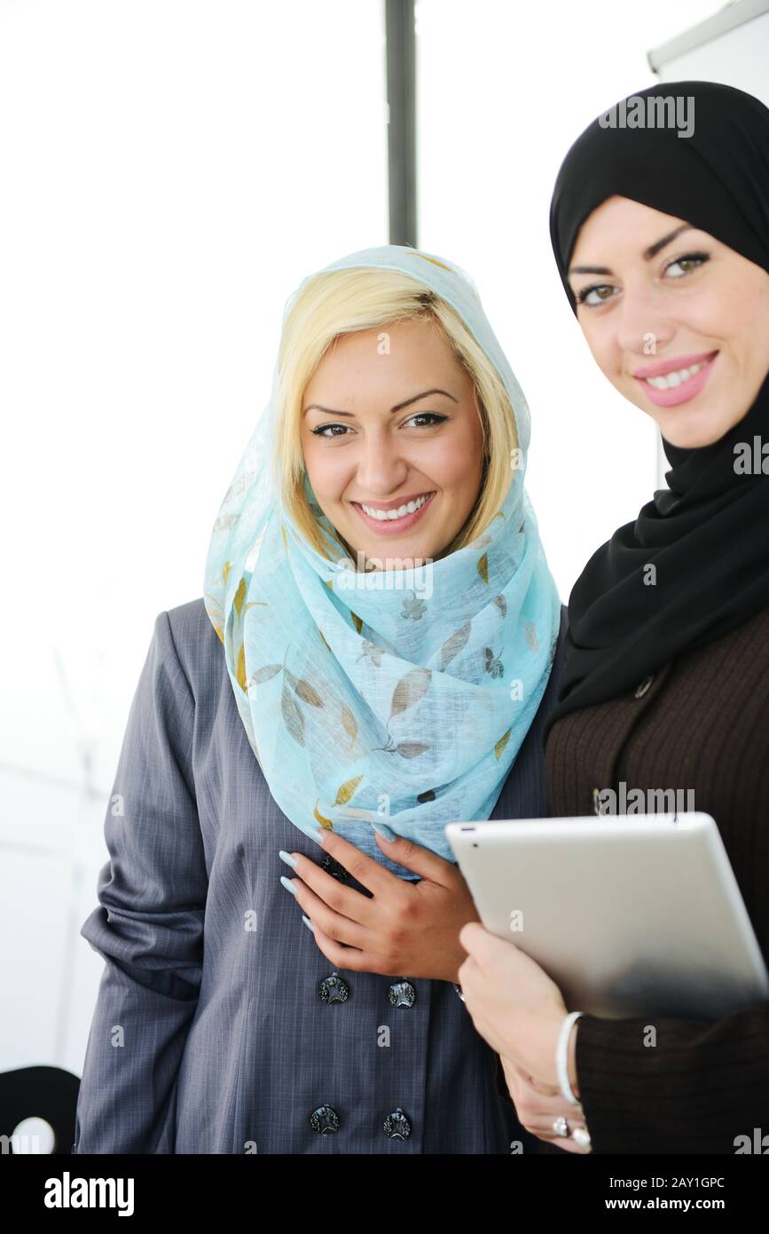 Group of Muslim women working Stock Photo - Alamy