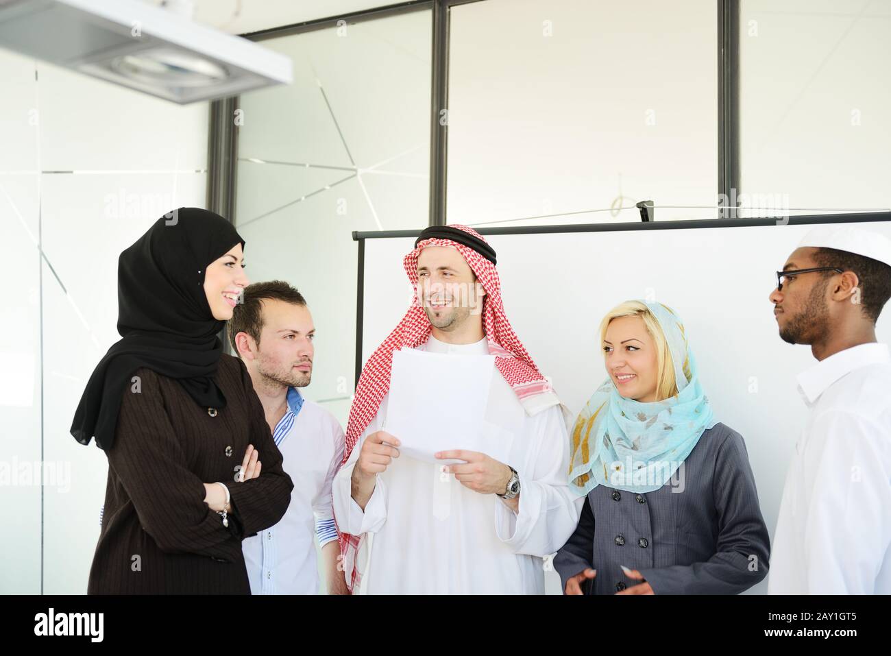 Group of multi ethnic business people at work Stock Photo - Alamy