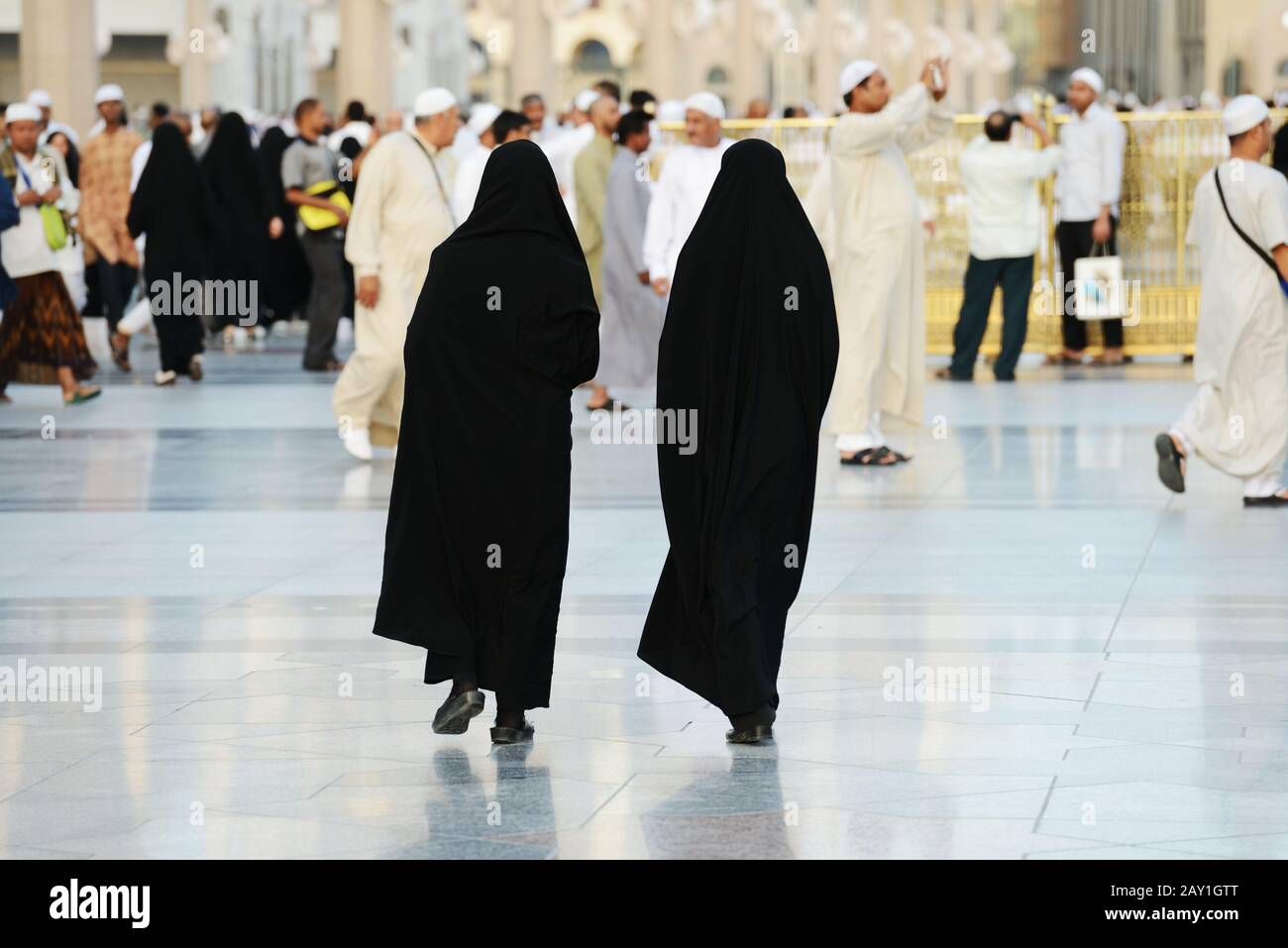 Two Muslim women walking Stock Photo - Alamy