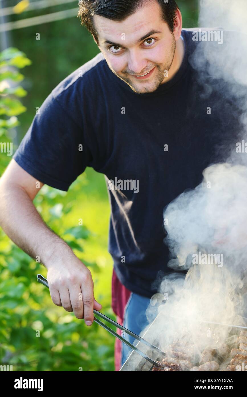 Male bbq burn hi-res stock photography and images - Alamy