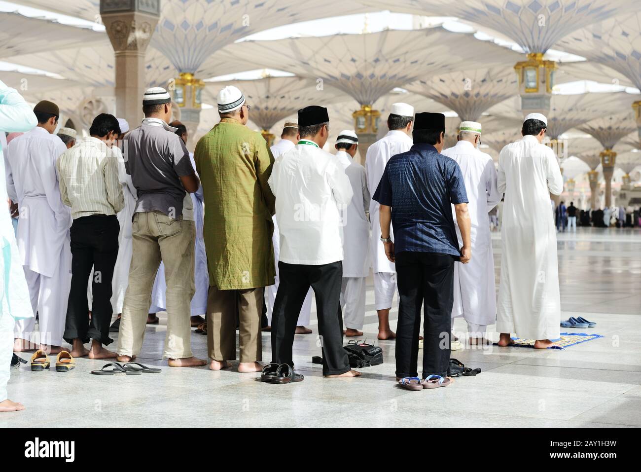 Muslims praying together at Holy mosque Stock Photo - Alamy