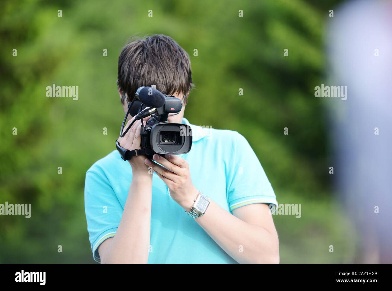 Cameraman filming outdoor Stock Photo - Alamy
