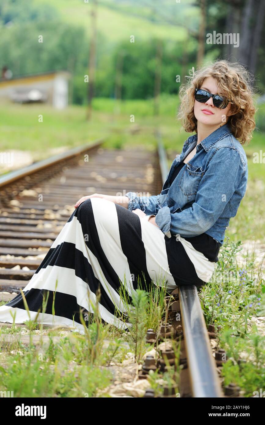 Woman Sitting On Railroad Tracks High Resolution Stock Photography and ...