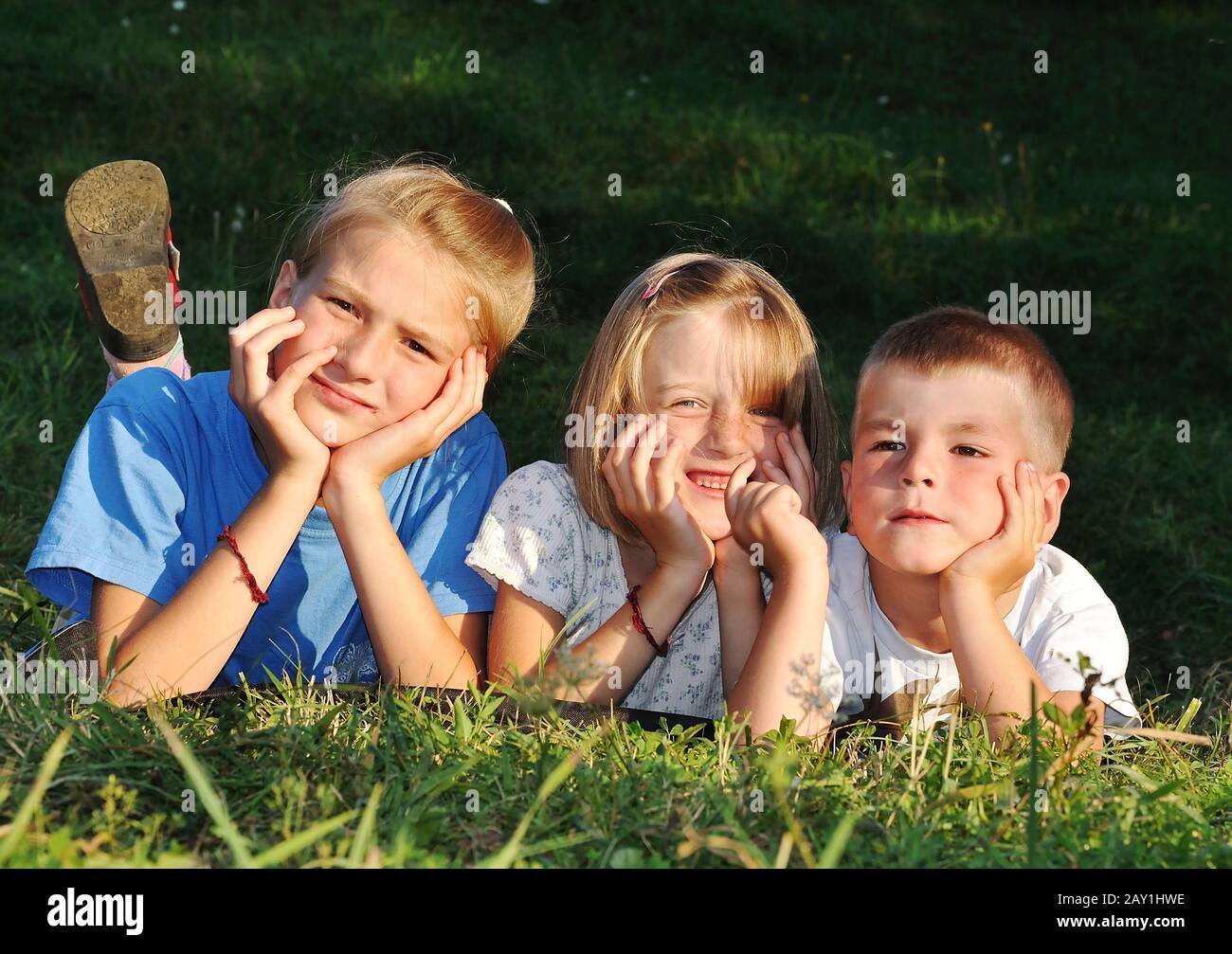 Children laying on the ground hi-res stock photography and images - Alamy