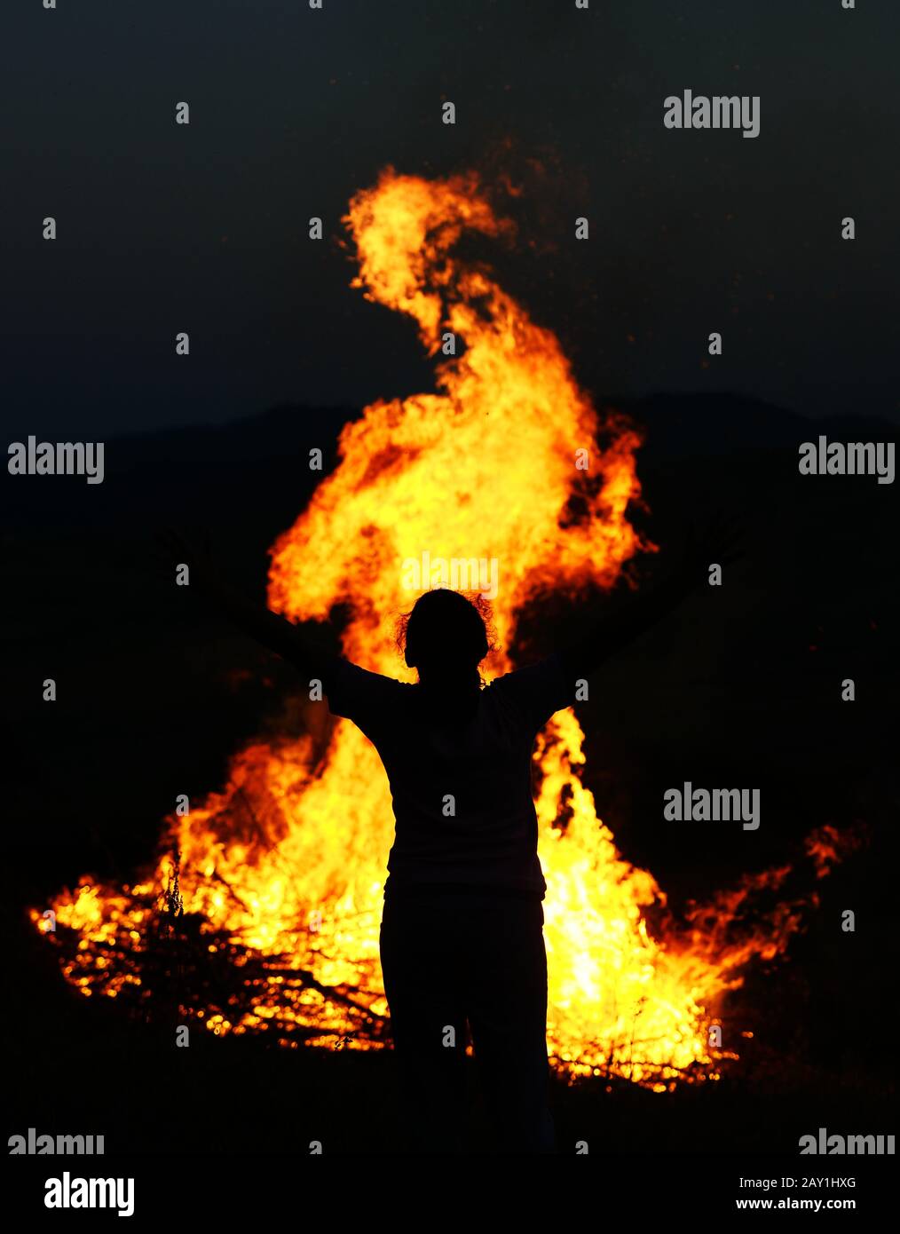 Child on fire with wide open arms Stock Photo - Alamy