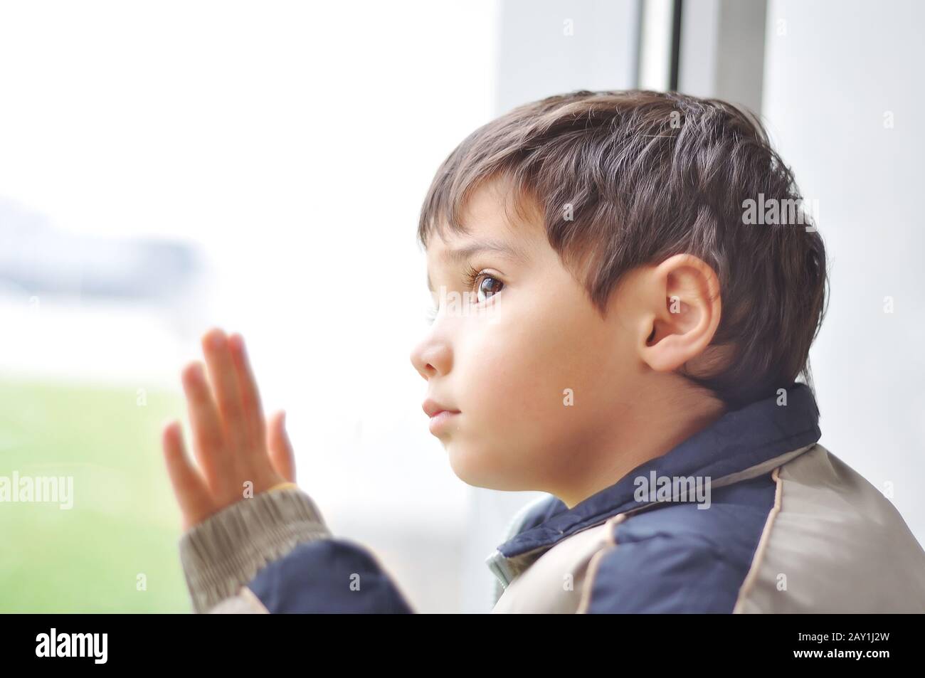 A kid on the window waiting Stock Photo - Alamy