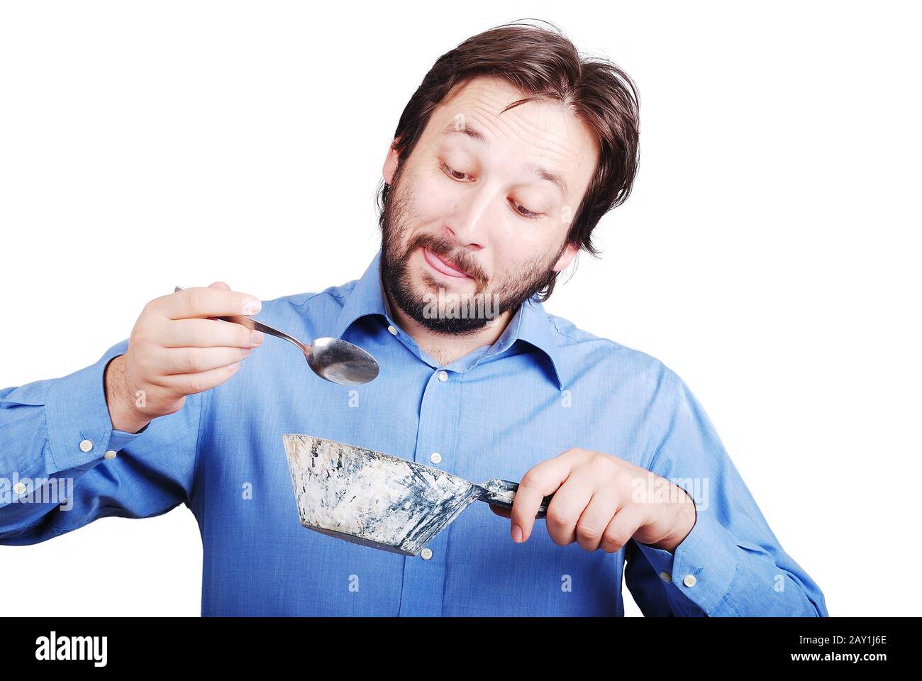 Young male model is about to eat cement Stock Photo - Alamy