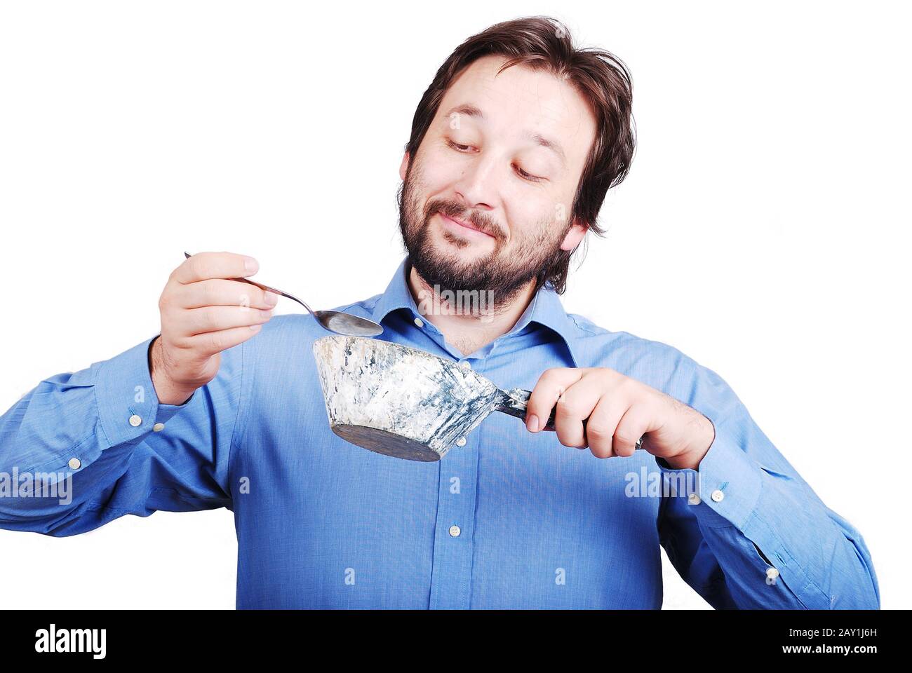 Young male model is about to eat cement Stock Photo - Alamy