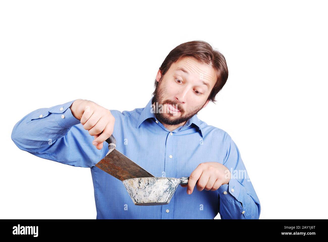 Young male model is about to eat cement Stock Photo - Alamy