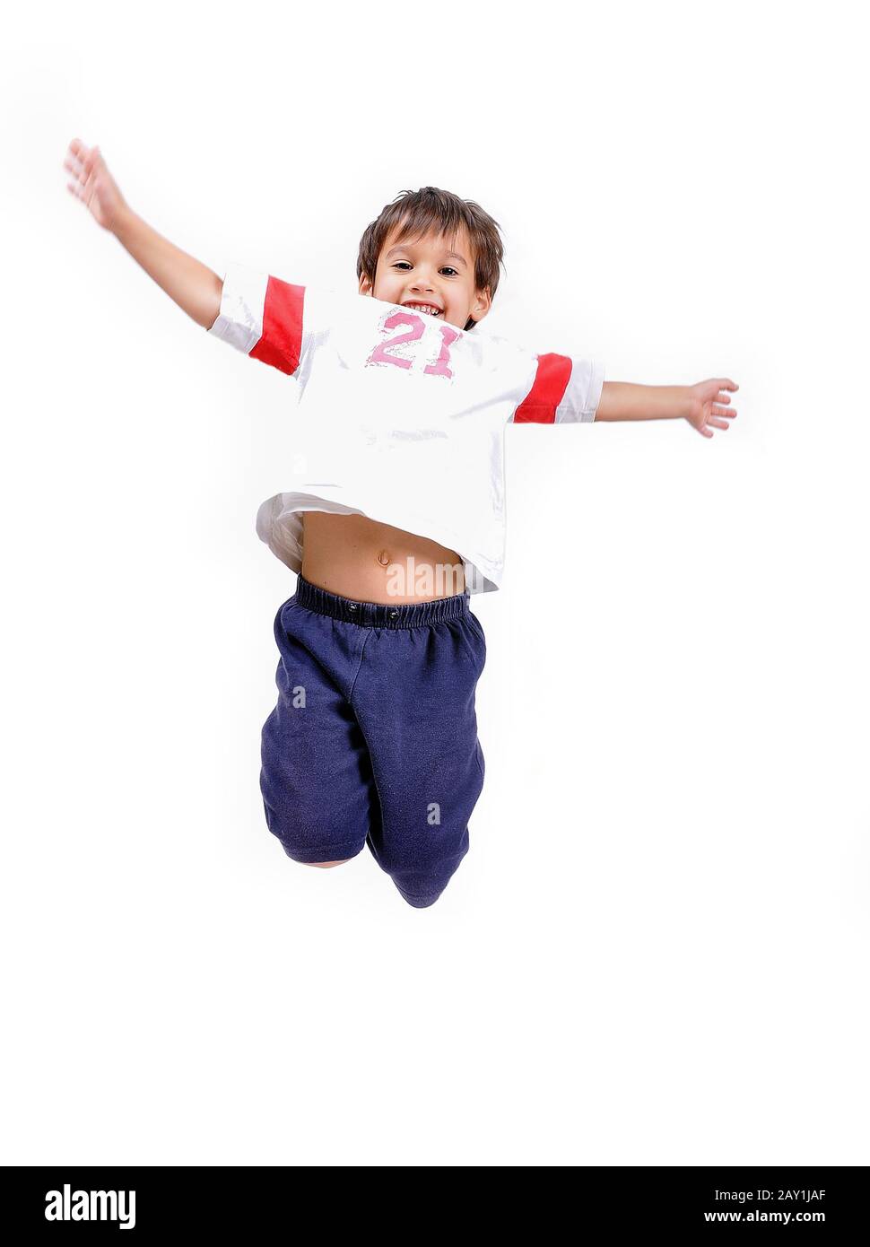 Very happy little cute child is jumping Stock Photo - Alamy