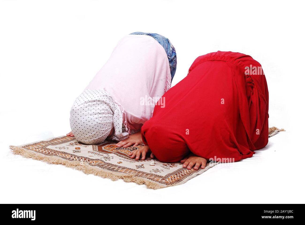 A young muslim girls in traditional clothes praying Stock Photo - Alamy