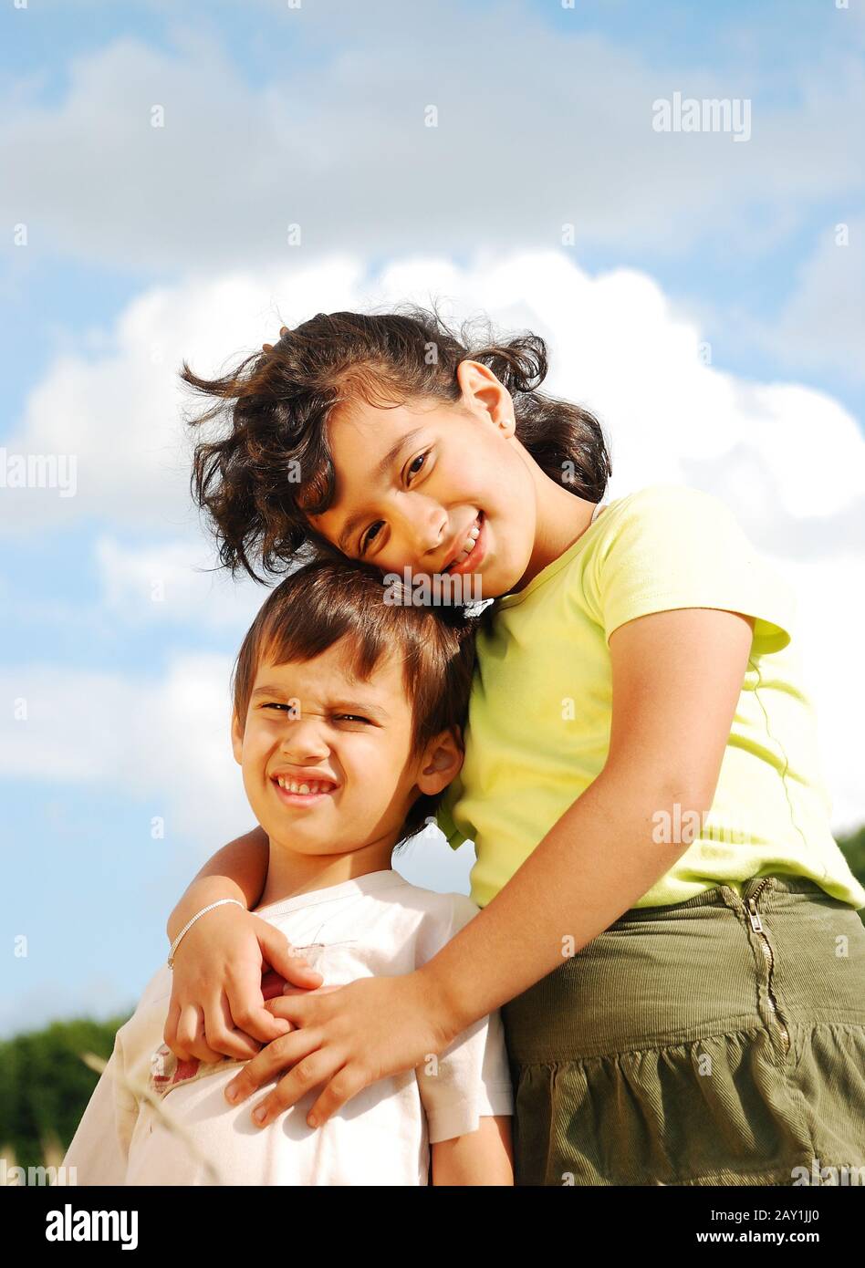Two kids smiling in nature Stock Photo - Alamy
