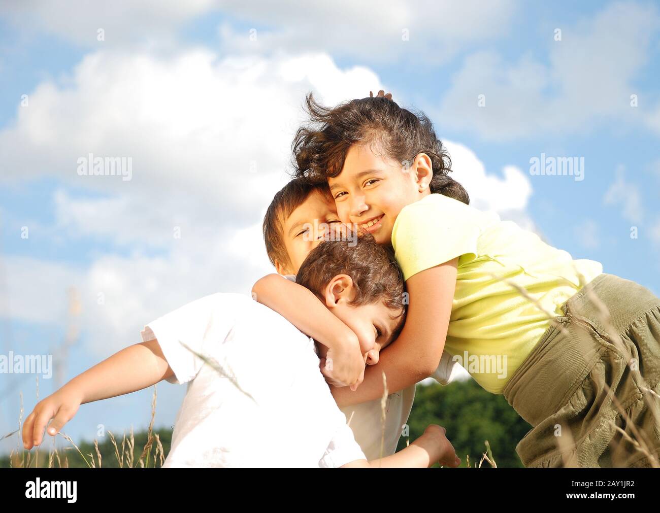 Happy brothers and sister Stock Photo - Alamy