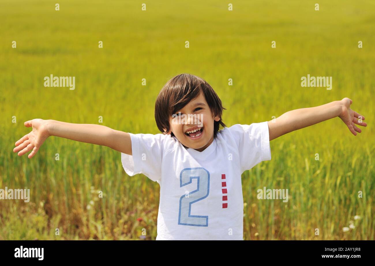 Happy boy with open arms outdoor Stock Photo - Alamy