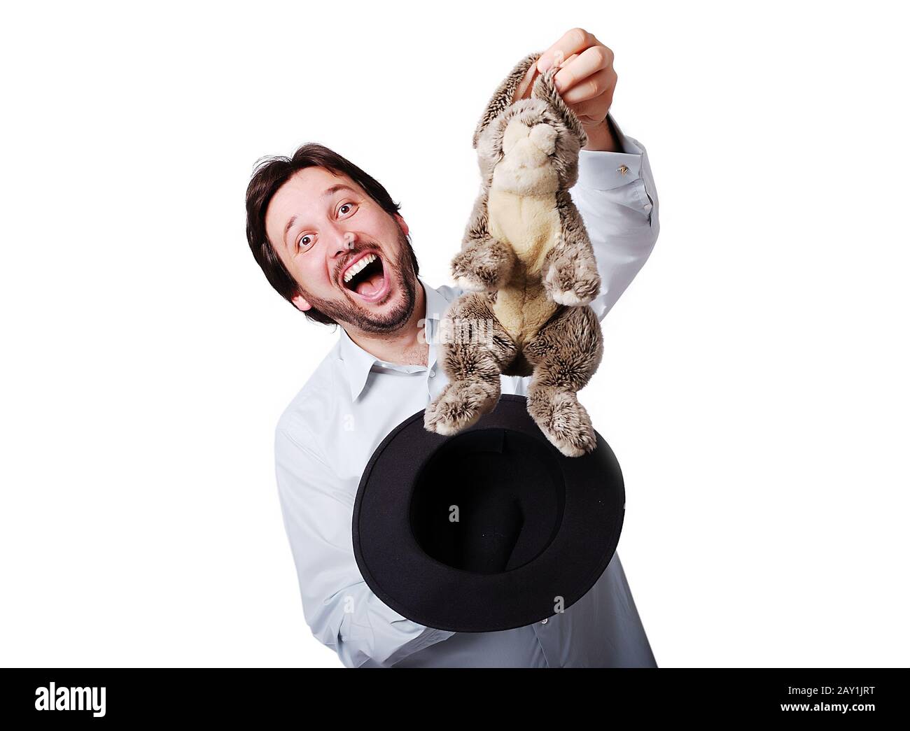 Funny man with big laugh with rabbit from the hat Stock Photo - Alamy