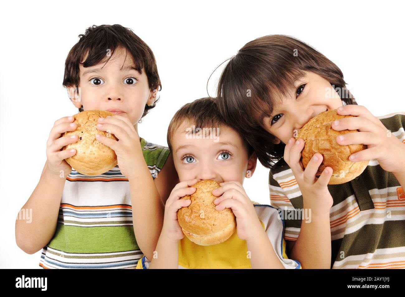 Three kids eating burgers Stock Photo - Alamy