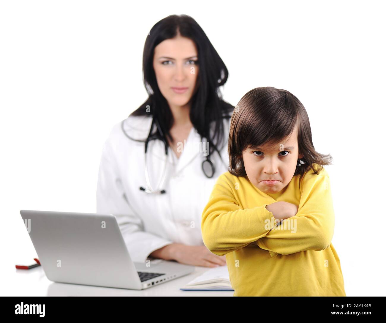 Young female doctor examining little cute angry child Stock Photo - Alamy