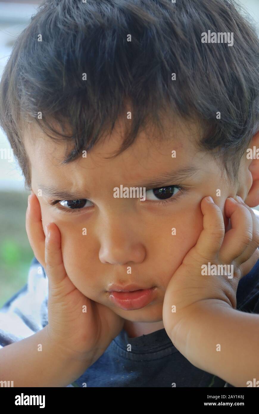 A little cute male child with anger on his face Stock Photo - Alamy