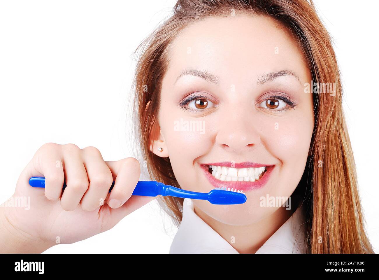 Beautiful attractive girl brushing her very bright and white teeth ...