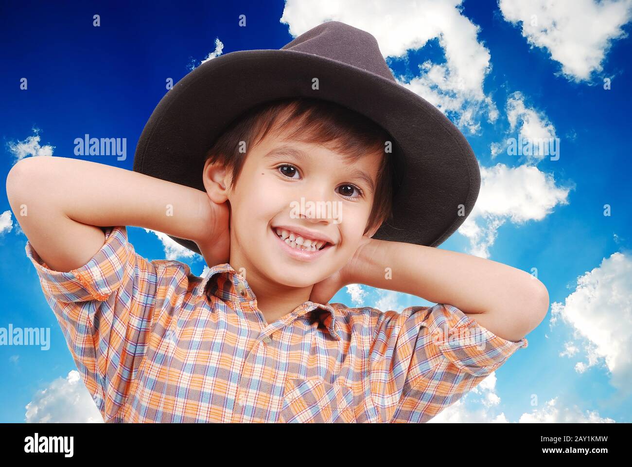 Beautiful little boy with hat on head Stock Photo - Alamy