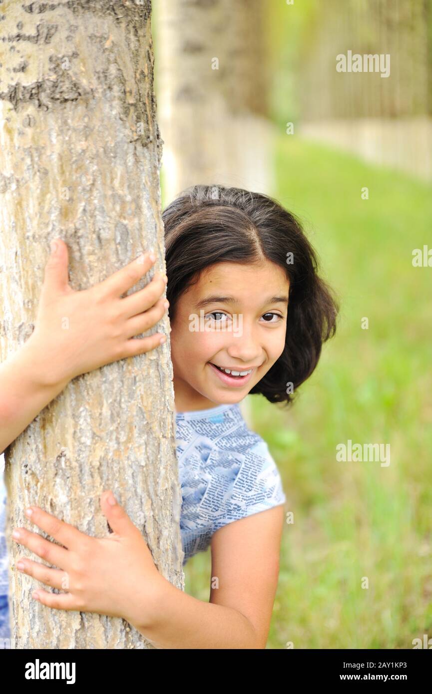 Child hiding behind plant hi-res stock photography and images - Alamy