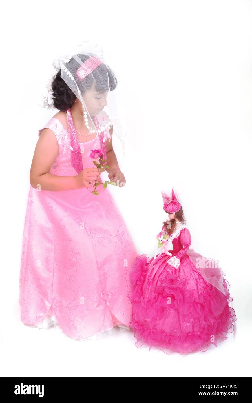 A little princess with rose and little toy Stock Photo - Alamy