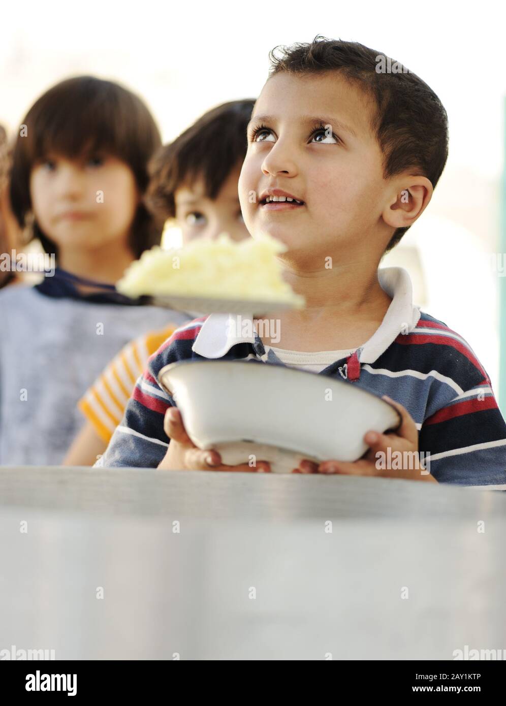 Hungry children in refugee camp Stock Photo - Alamy