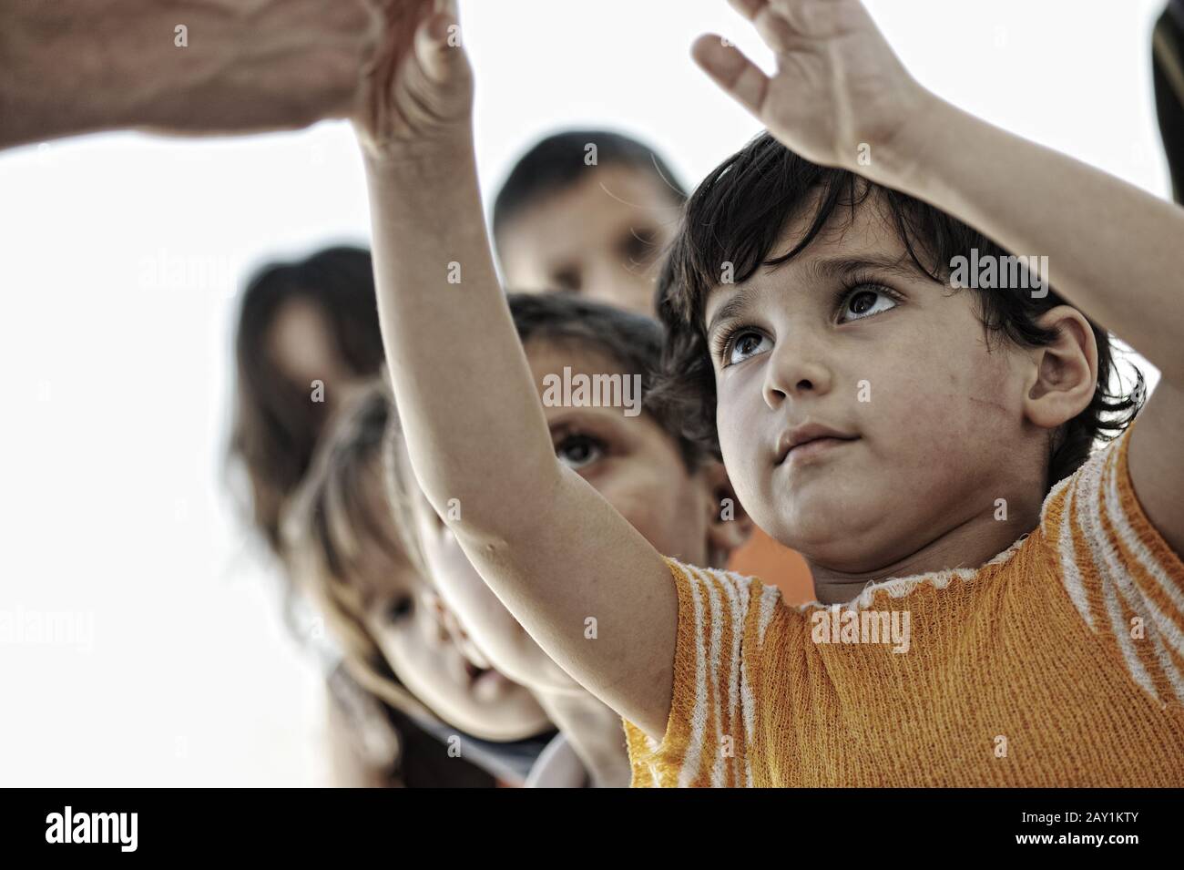 Hungry children in refugee camp Stock Photo - Alamy