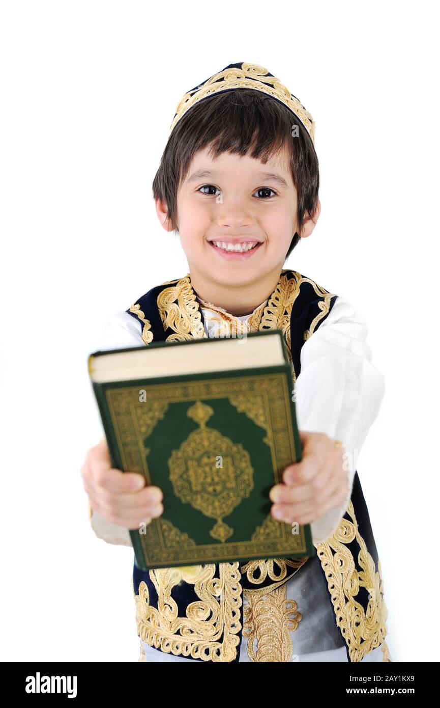 Happy muslim kid holding holy Quran Stock Photo - Alamy