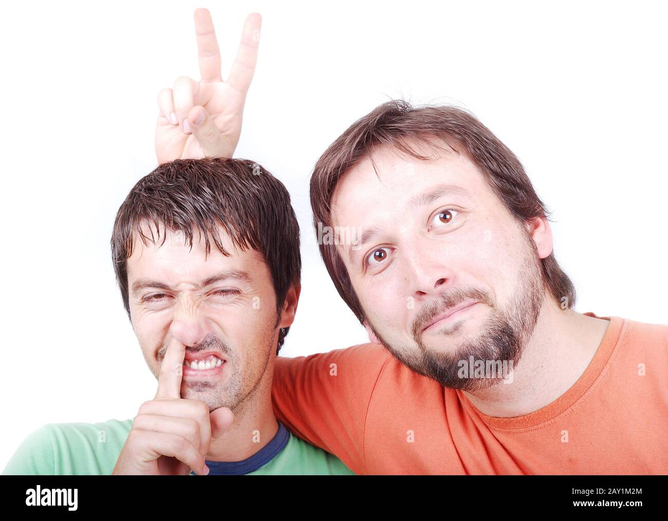 Two funny men are laughing and showing signs Stock Photo - Alamy