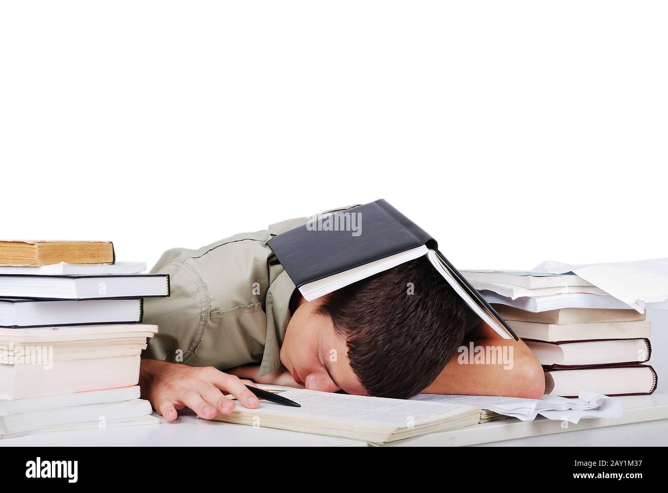 Young man fallen asleep after long reading Stock Photo - Alamy