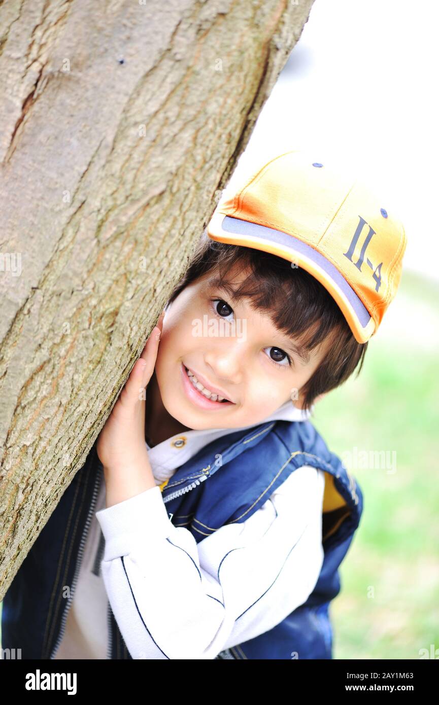 Kid and tree Stock Photo - Alamy