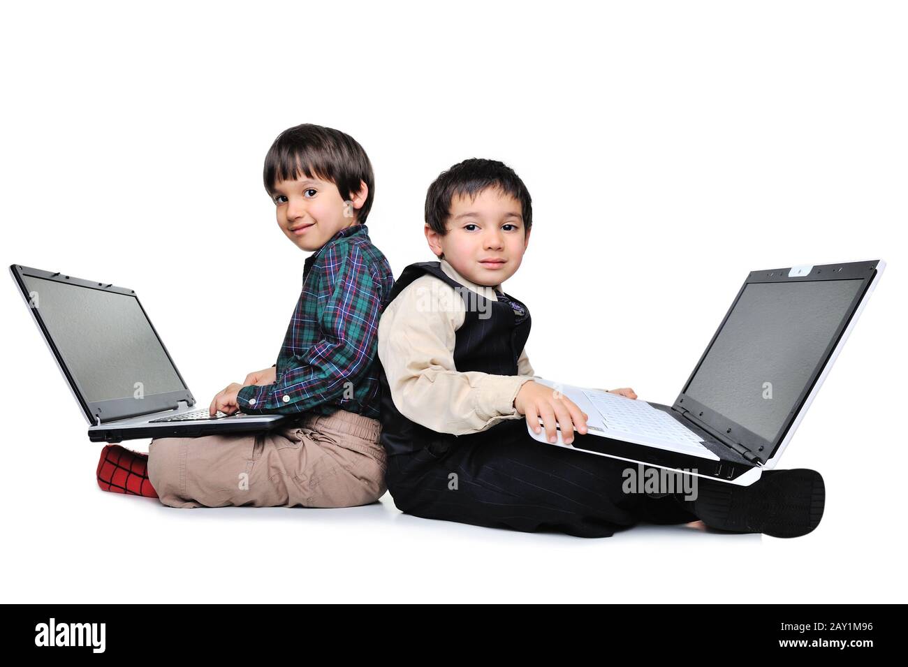 Two boys with laptops Stock Photo - Alamy