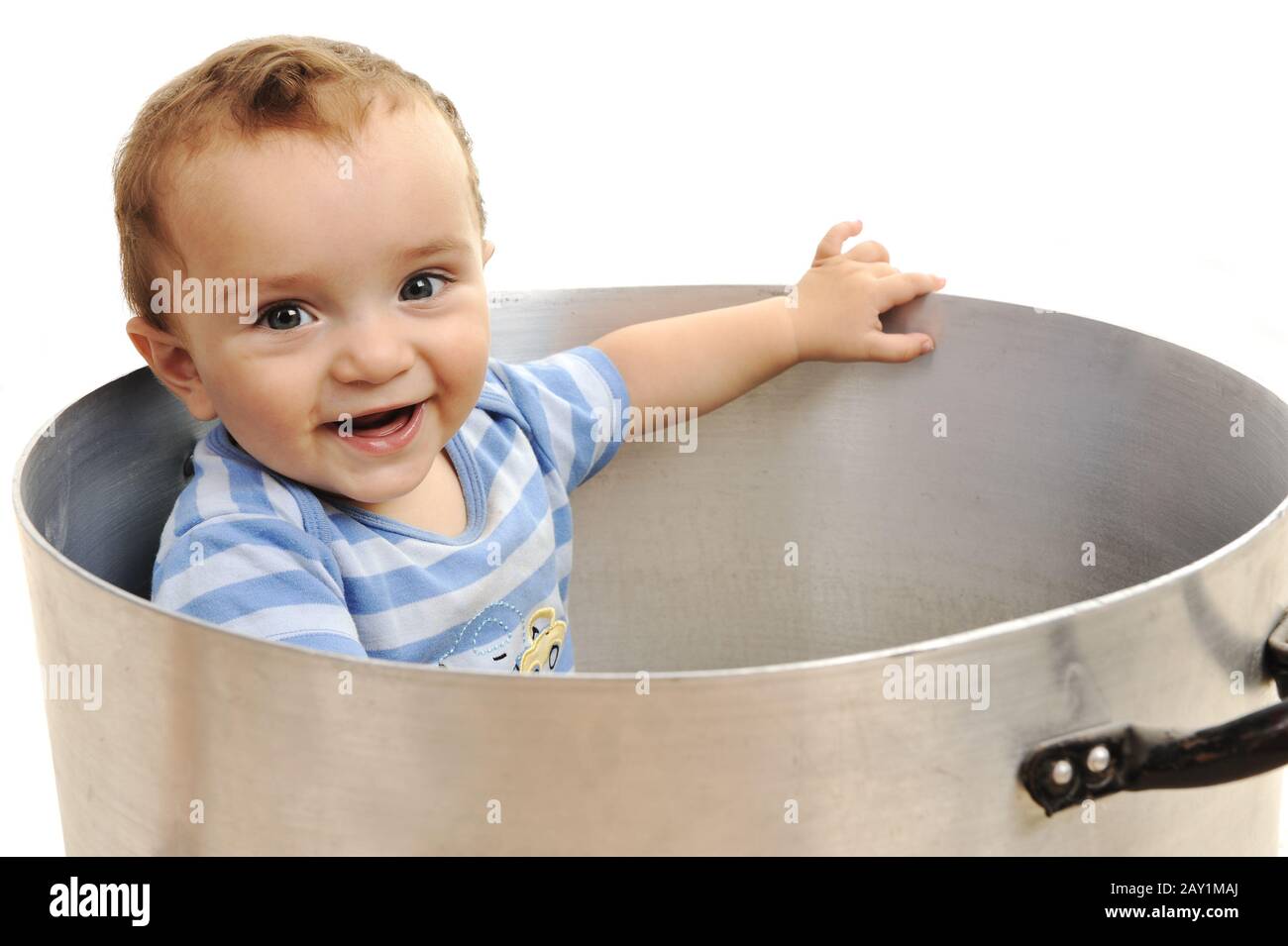 Cute child in pot, playing together, brothers Stock Photo - Alamy