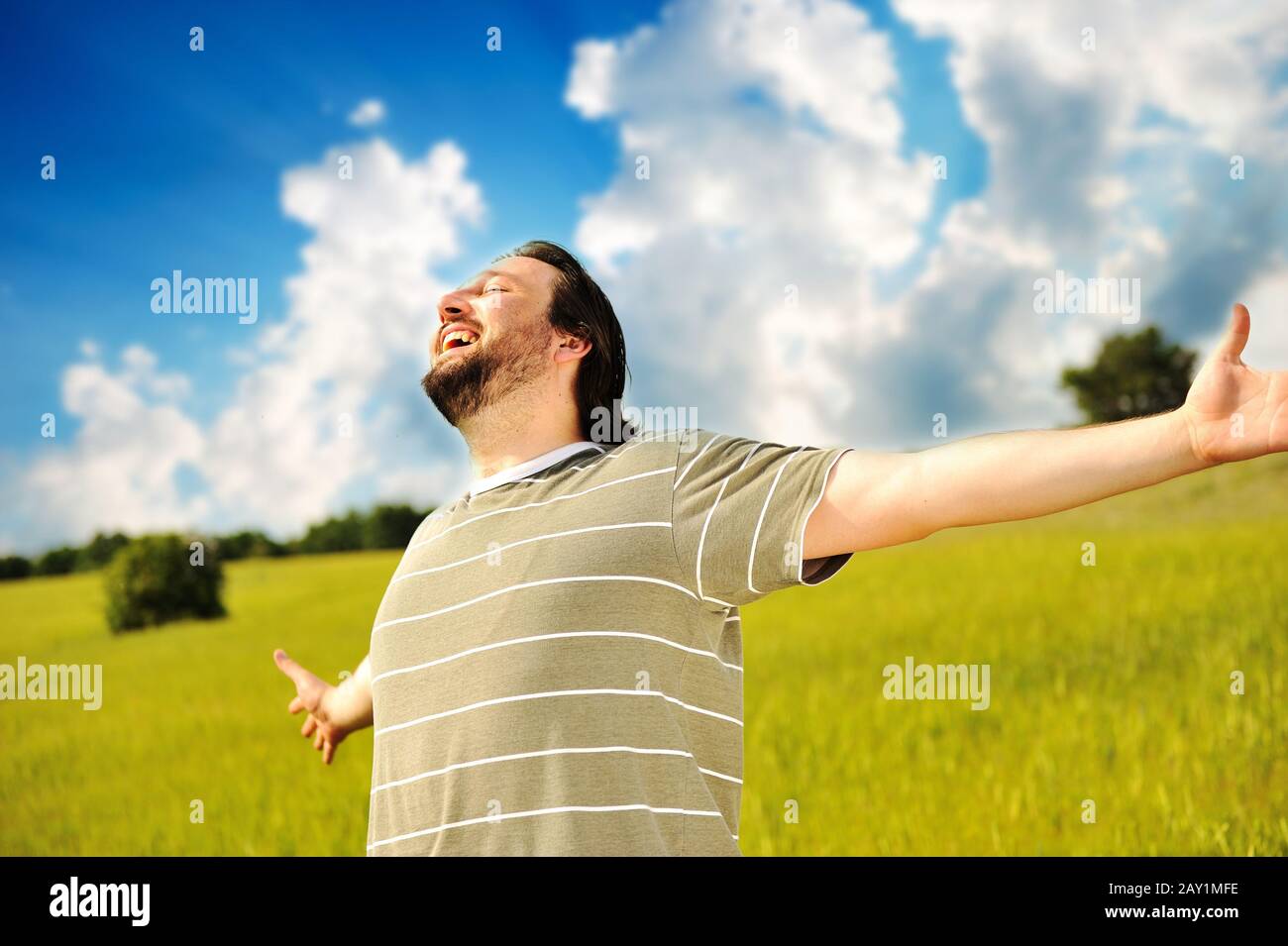 Happy succesful man in nature with wide open arms Stock Photo - Alamy