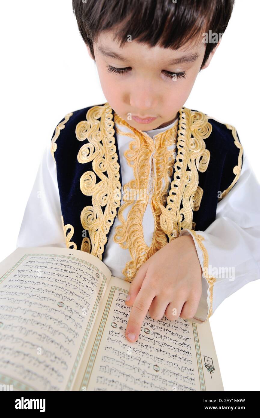 Muslim kid reading Quran Stock Photo - Alamy