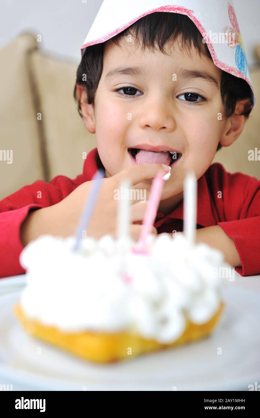 little cute kid and his birthday cake Stock Photo - Alamy