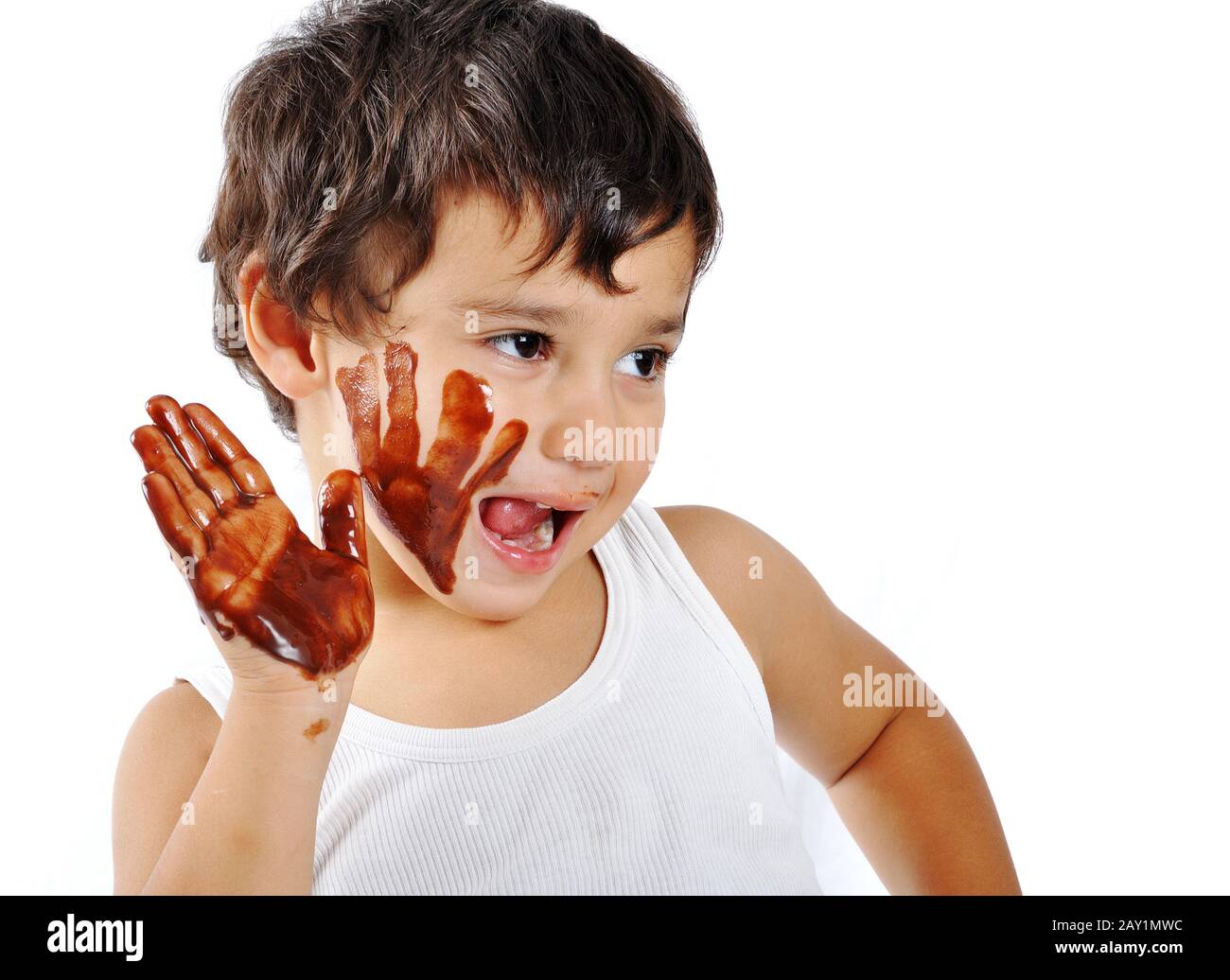 Cute messy kid isolated on white eating chocolate Stock Photo - Alamy