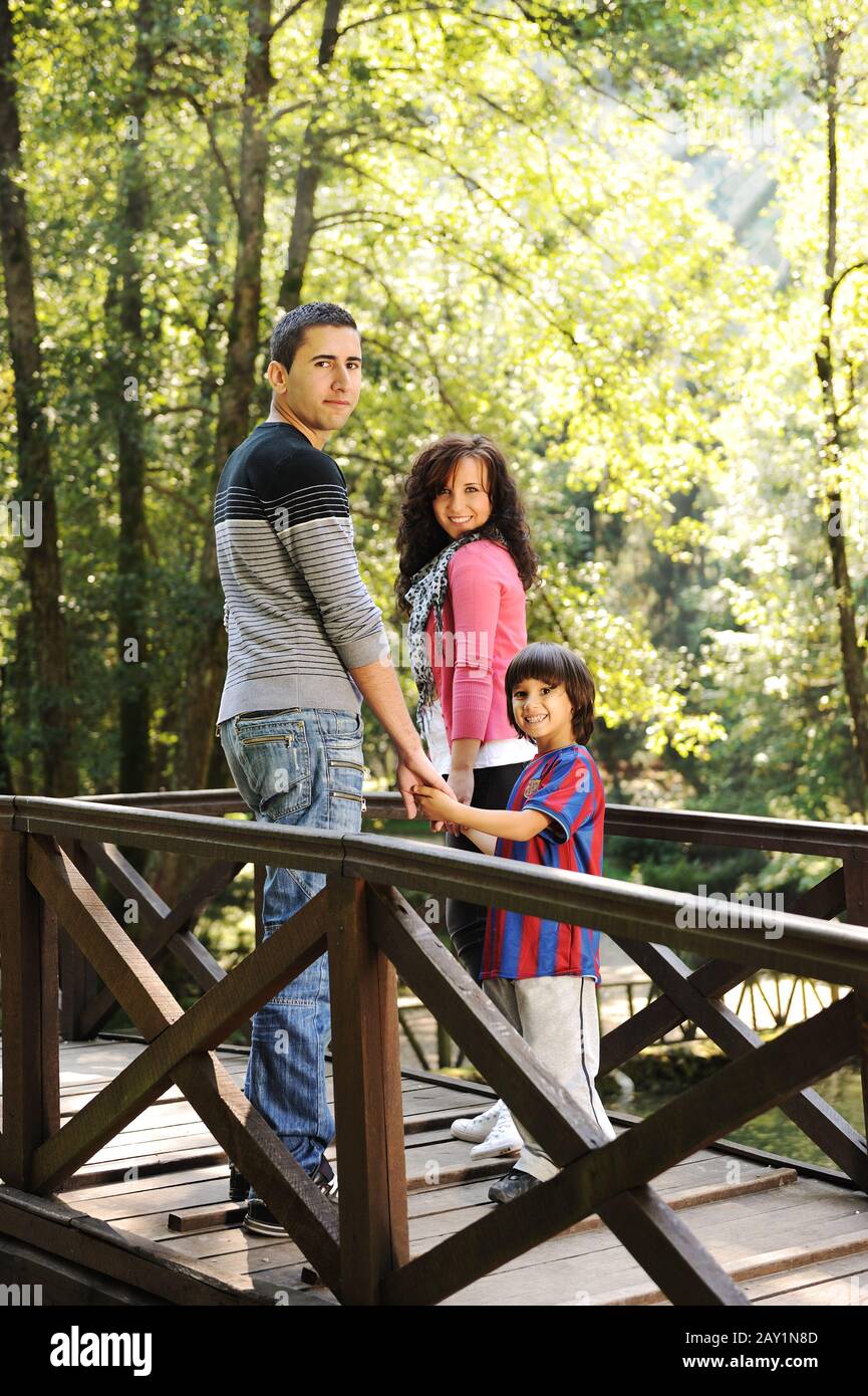 Beautiful scene of young happy family walking in nature together Stock ...