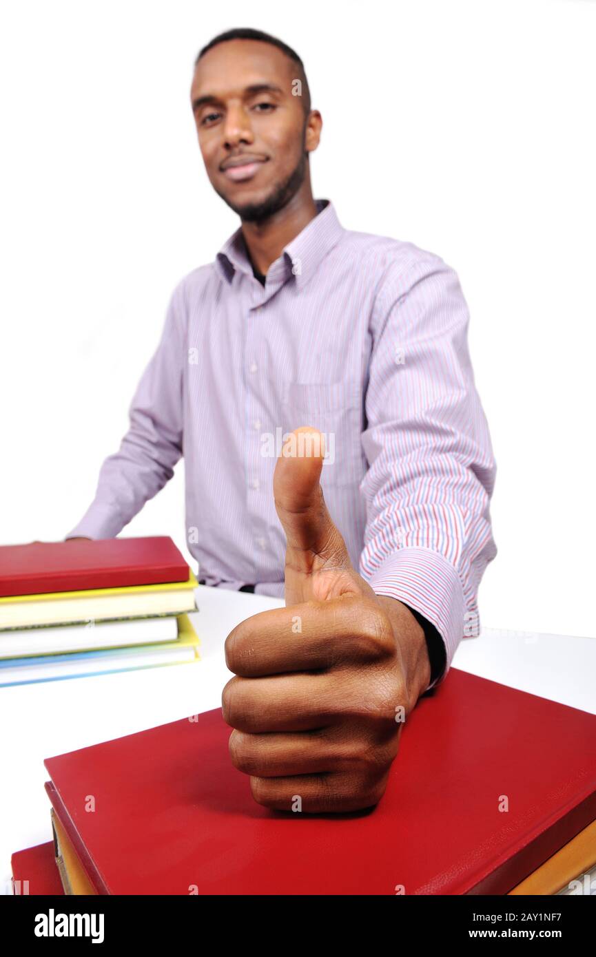 Young student with thumbs up Stock Photo - Alamy