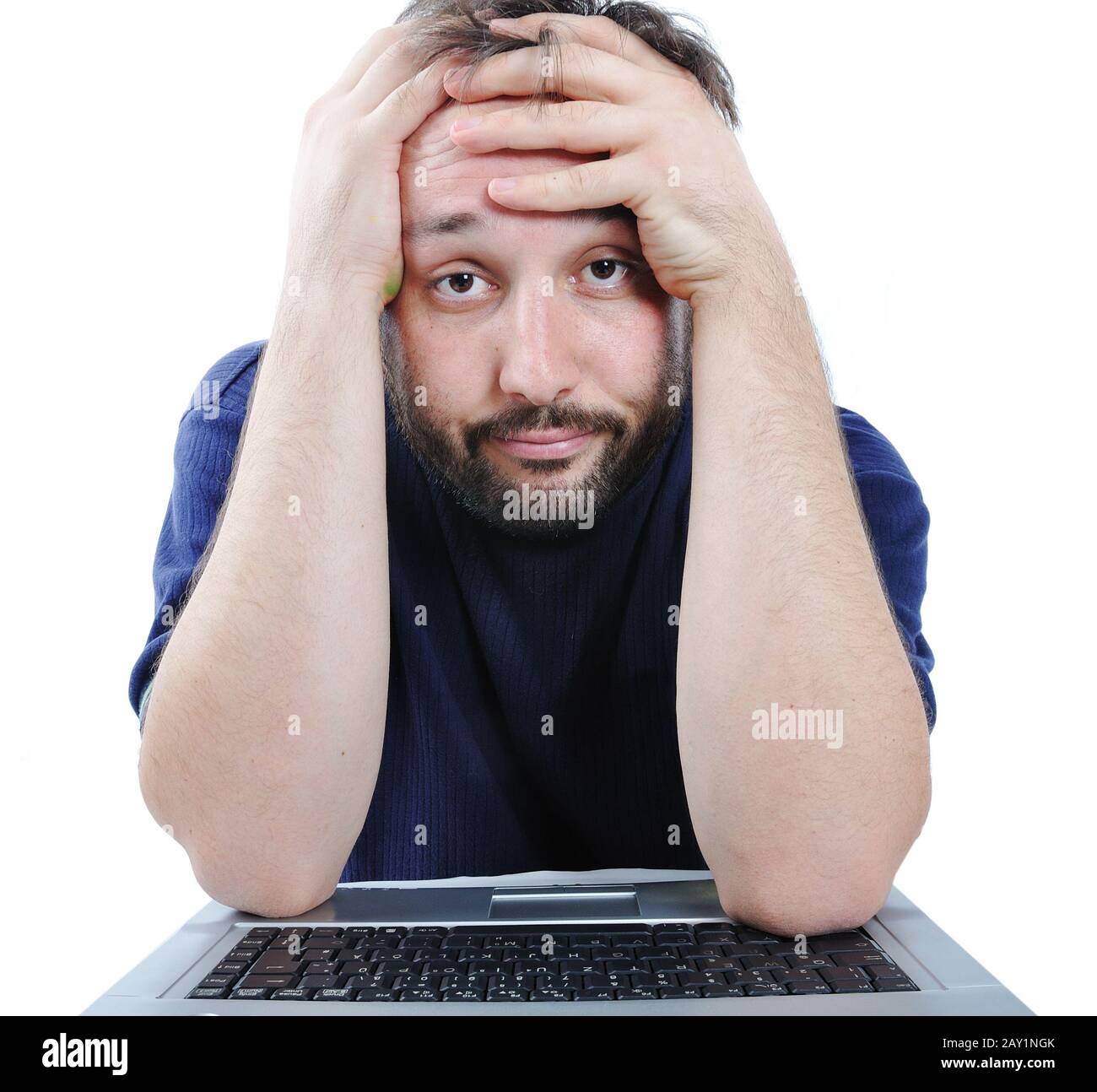 man looking at computer in desperation Stock Photo - Alamy