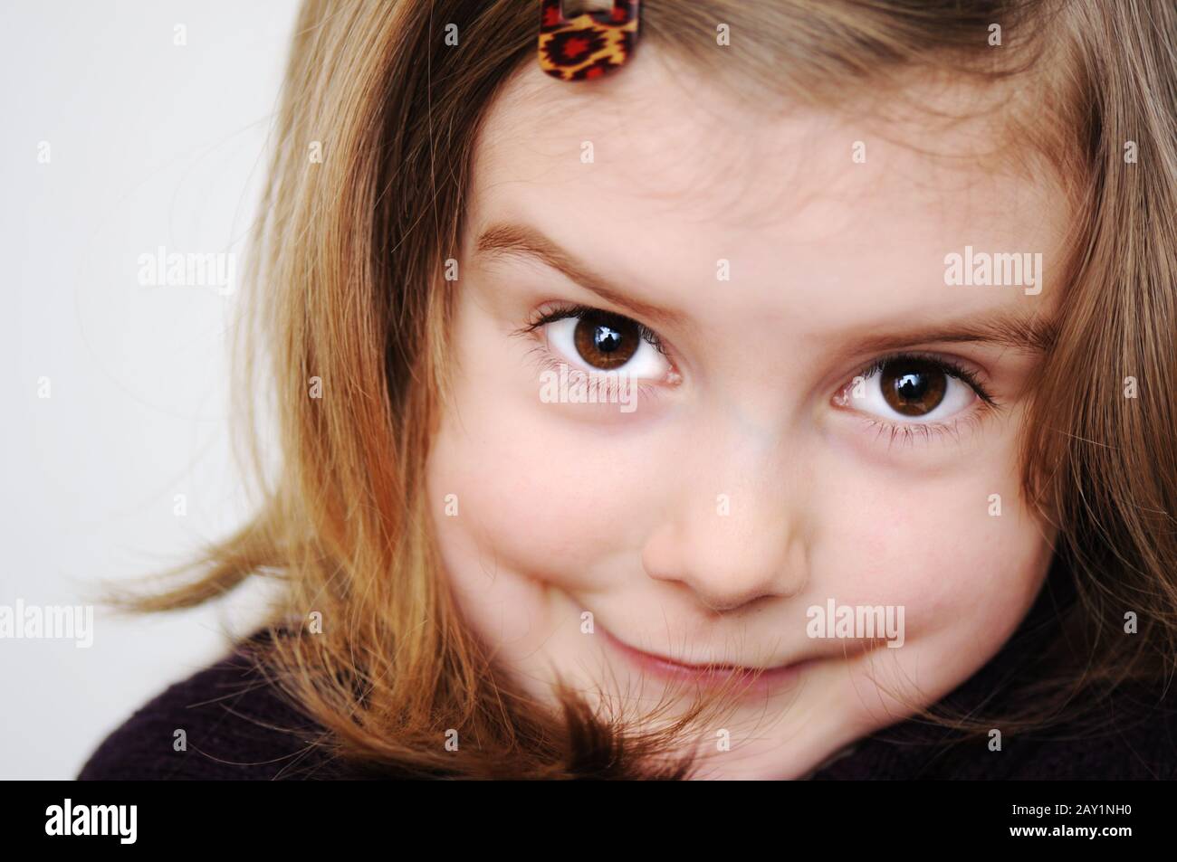 Adorable little girl making silly funny faces isolated on white ...