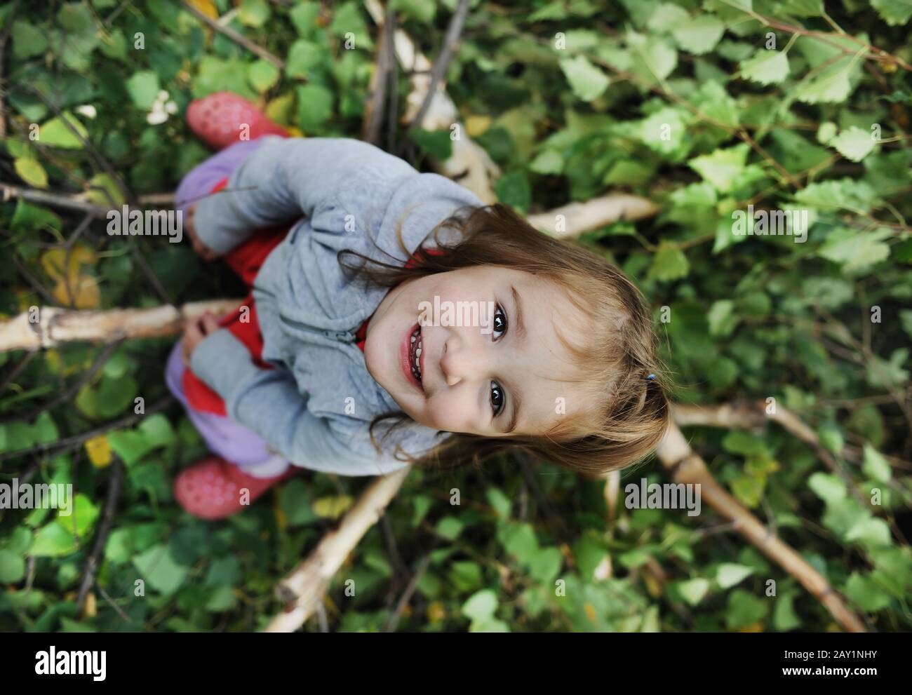 Child looking at ground leaves hi-res stock photography and images - Alamy