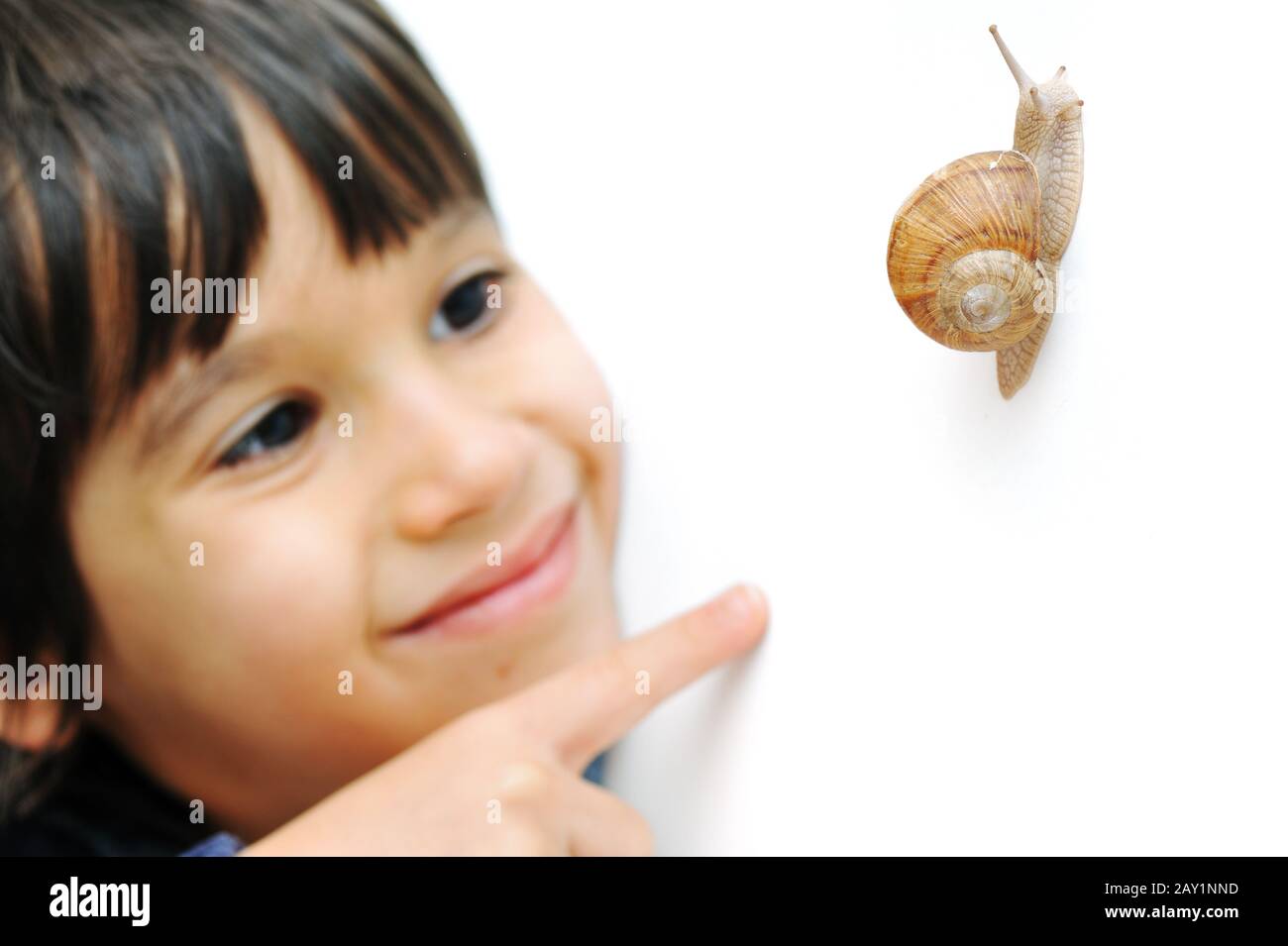 Snail and kid Stock Photo - Alamy